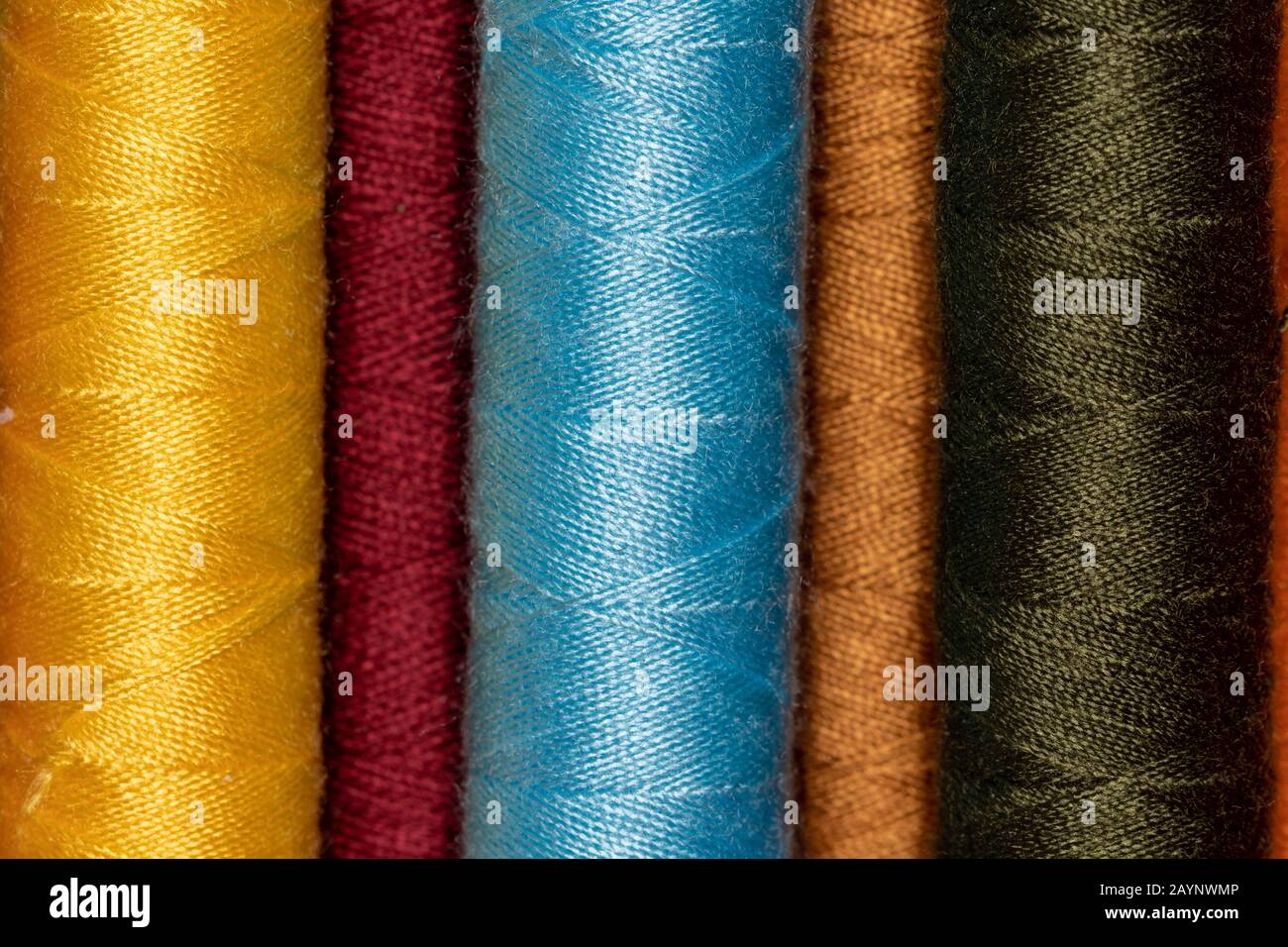 Vertical cones with colored sewing thread Stock Photo - Alamy