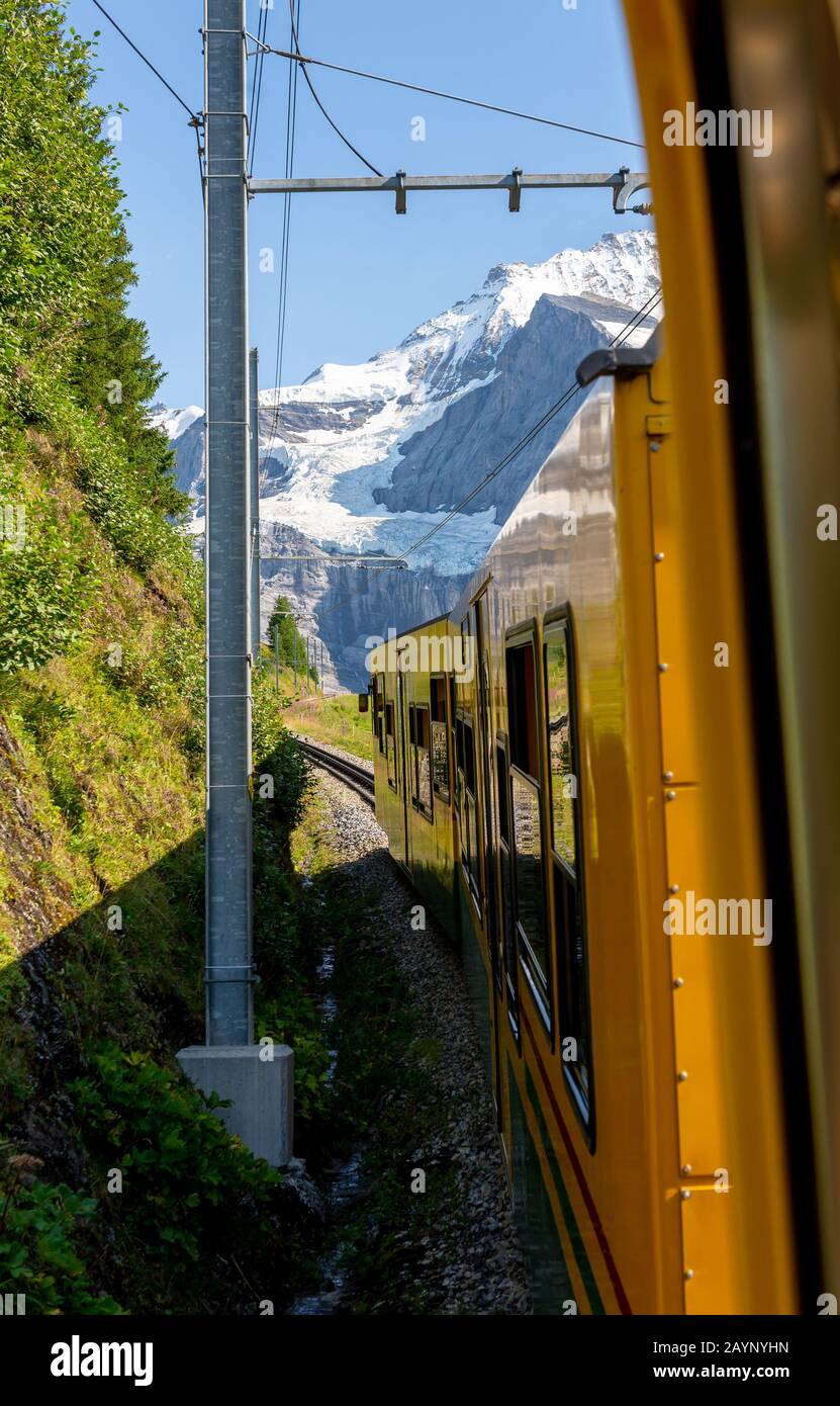 Beautiful Swiss Alps views on the yellow train of the Wengernalp ...