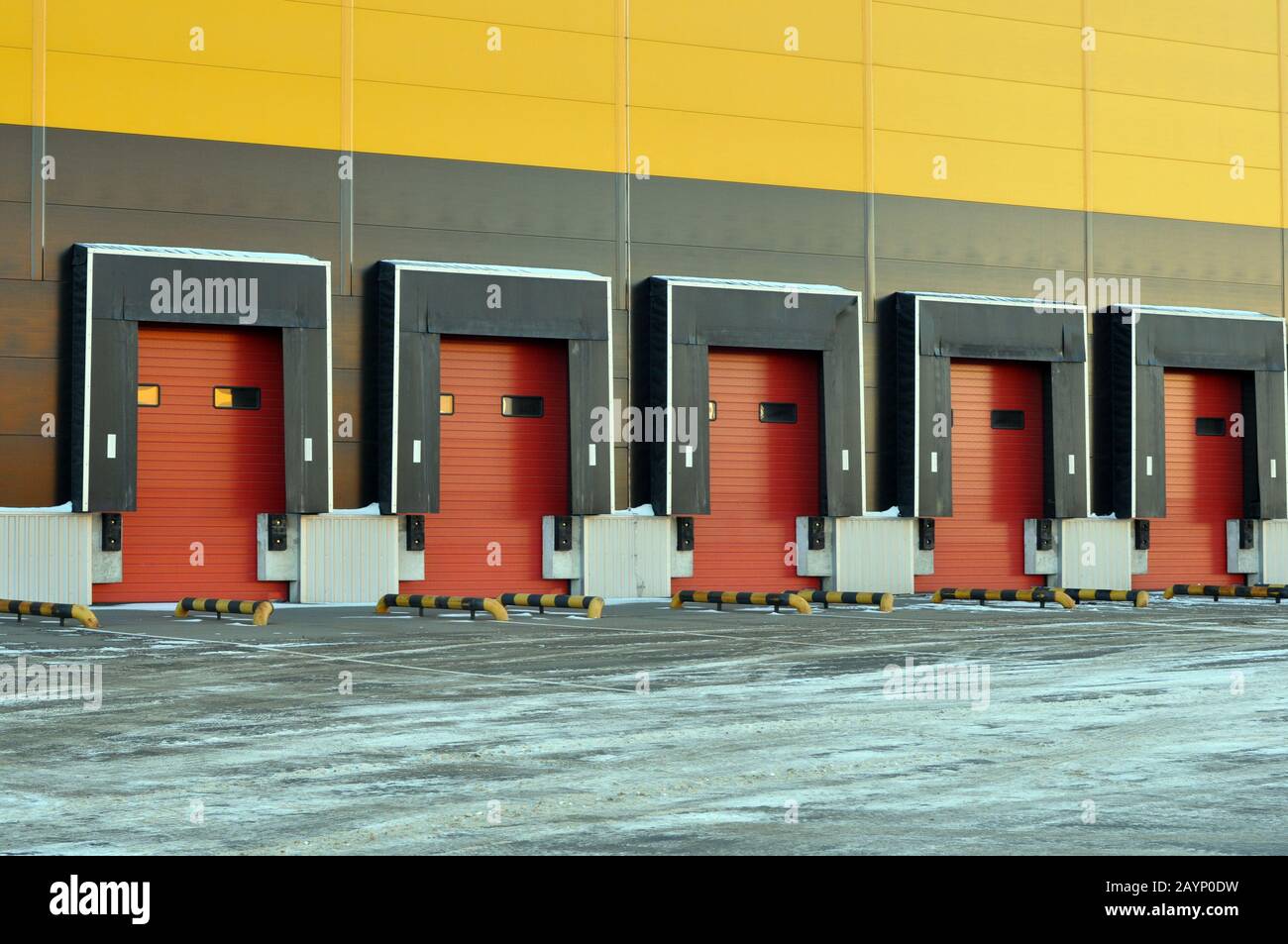 Front view of loading docks of a modern logistics center. Logistics ...