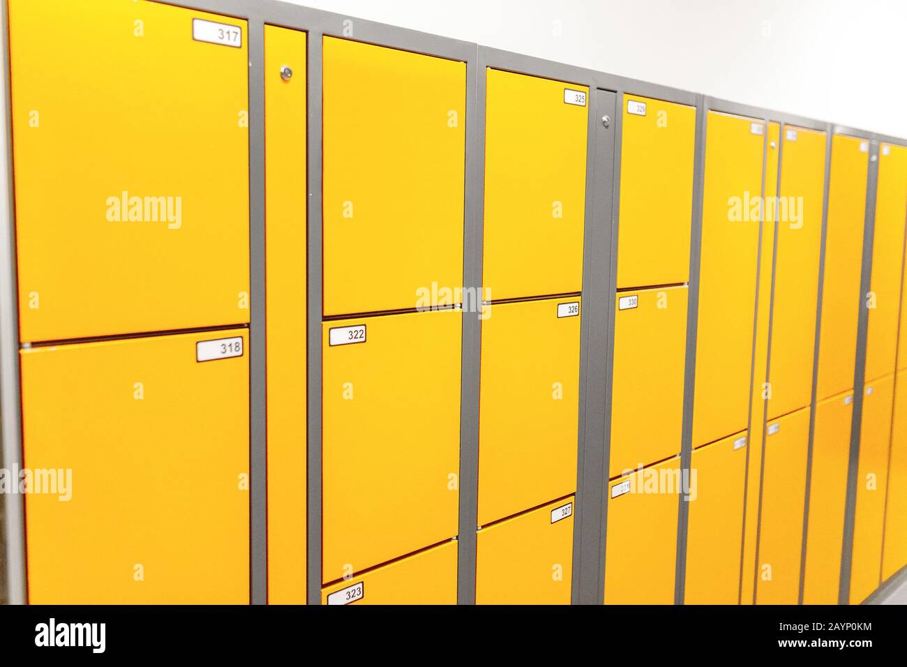 Yellow modern locker or self-service post terminal Stock Photo - Alamy