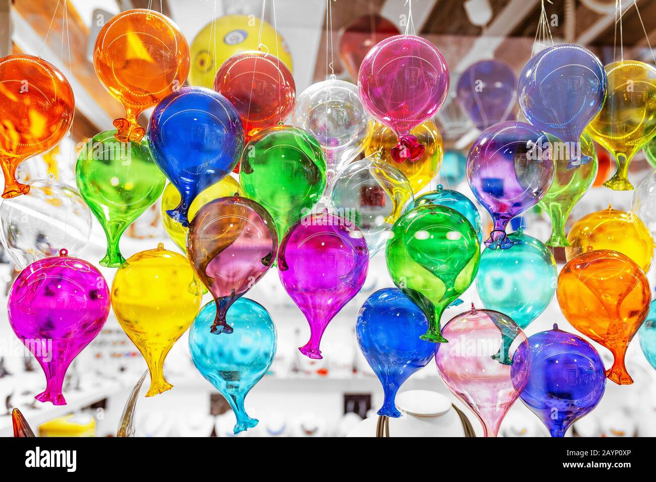 Colorful decorated objects made of a famous murano glass in a shop ...