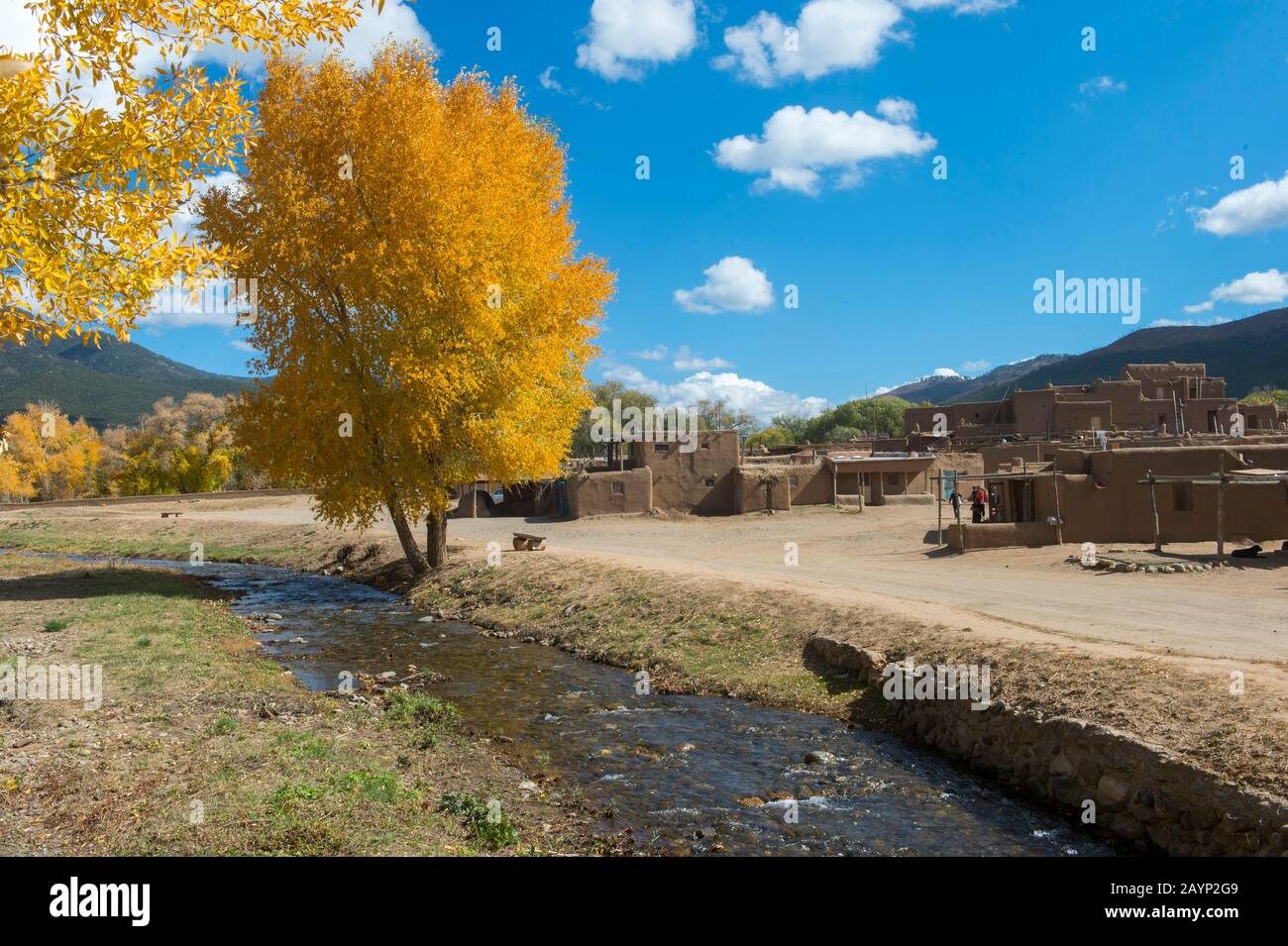 Trees with fall colors at the Taos Pueblo which is the only living ...