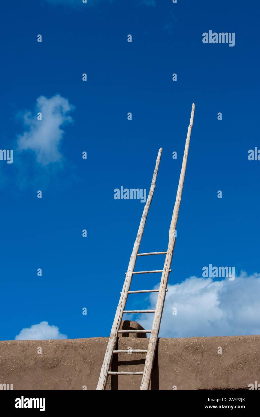 Ladders being used to move to different levels of the Taos Pueblo which ...