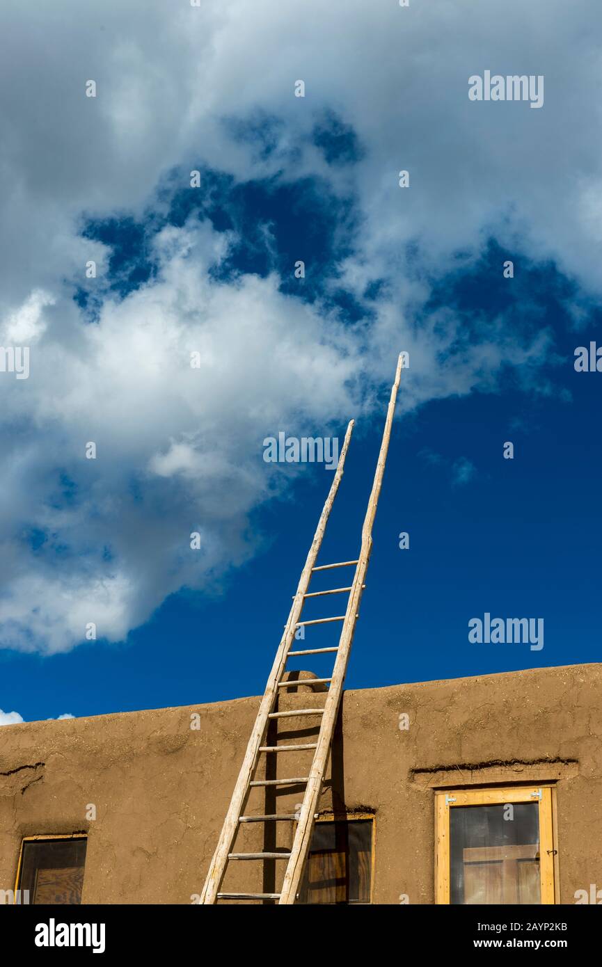 Ladders being used to move to different levels of the Taos Pueblo which ...