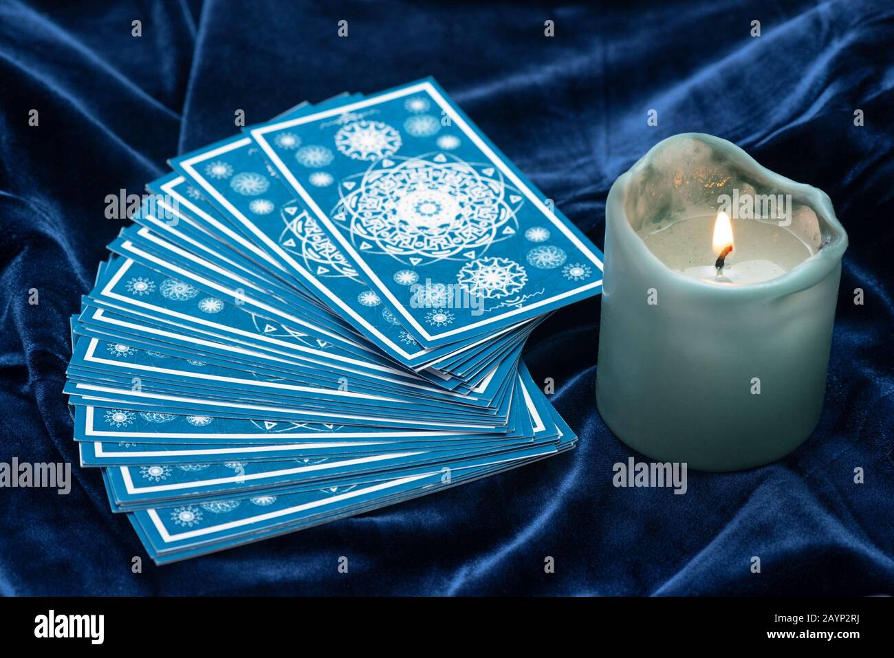 Blue tarot cards on blue velvet cloth background Stock Photo - Alamy