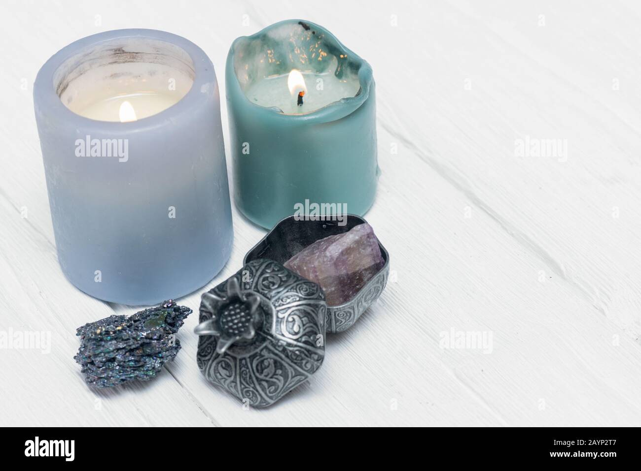 Magic stones on white wooden table background Stock Photo - Alamy