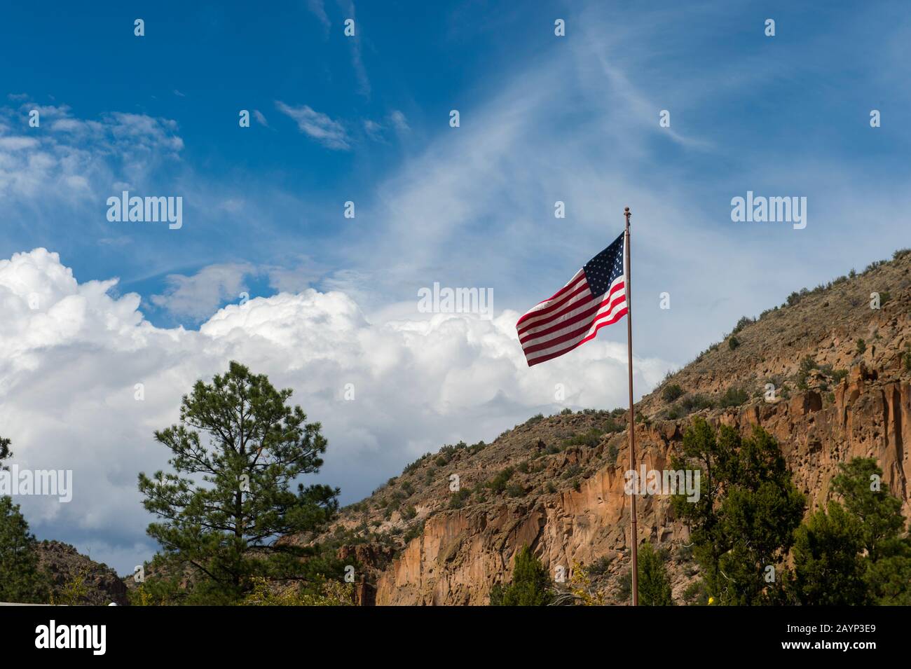 The American National Flag is flying over the Bandelier National ...