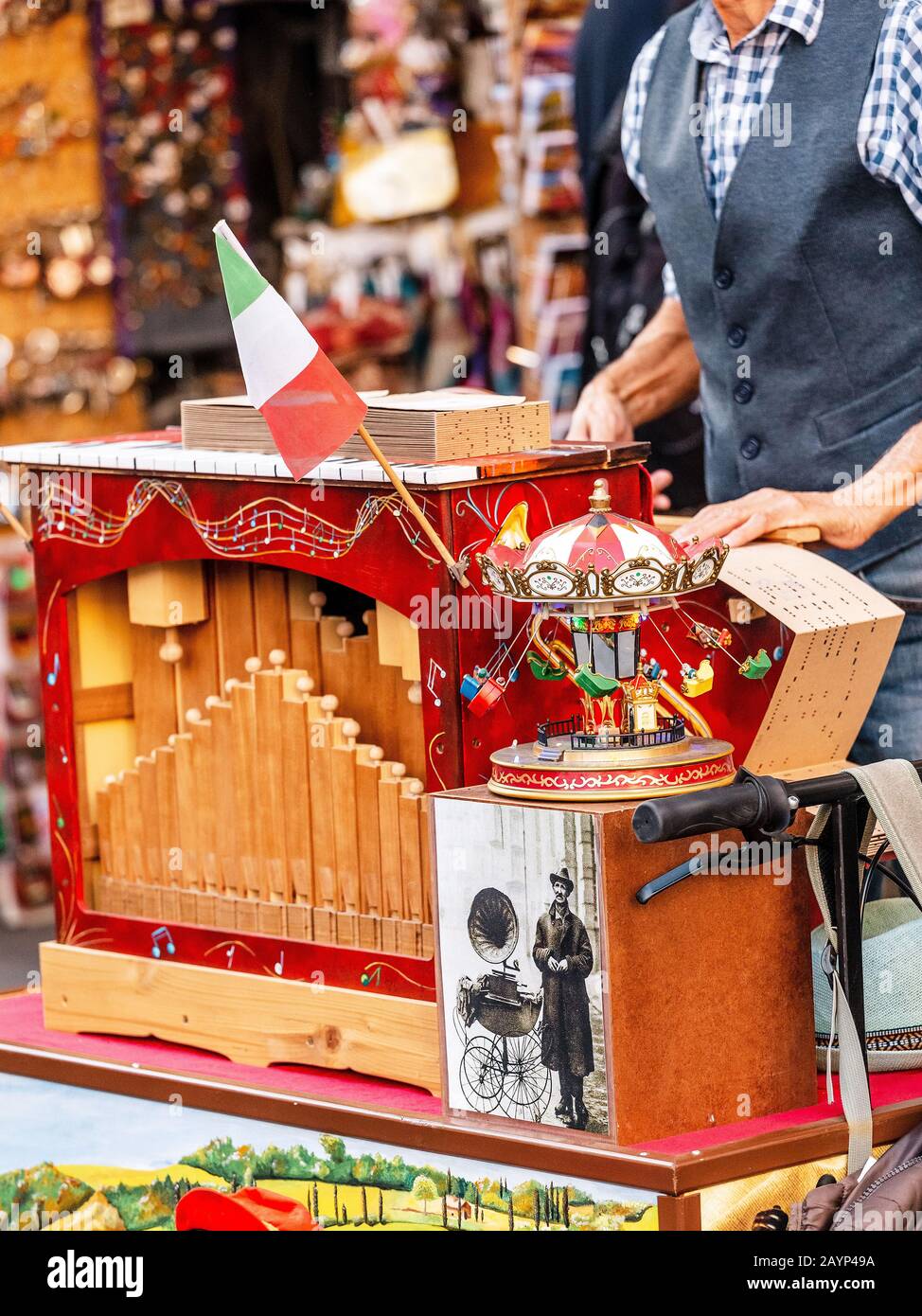19 OCTOBER 2018, FLORENCE, ITALY: A street artist playing wooden music ...