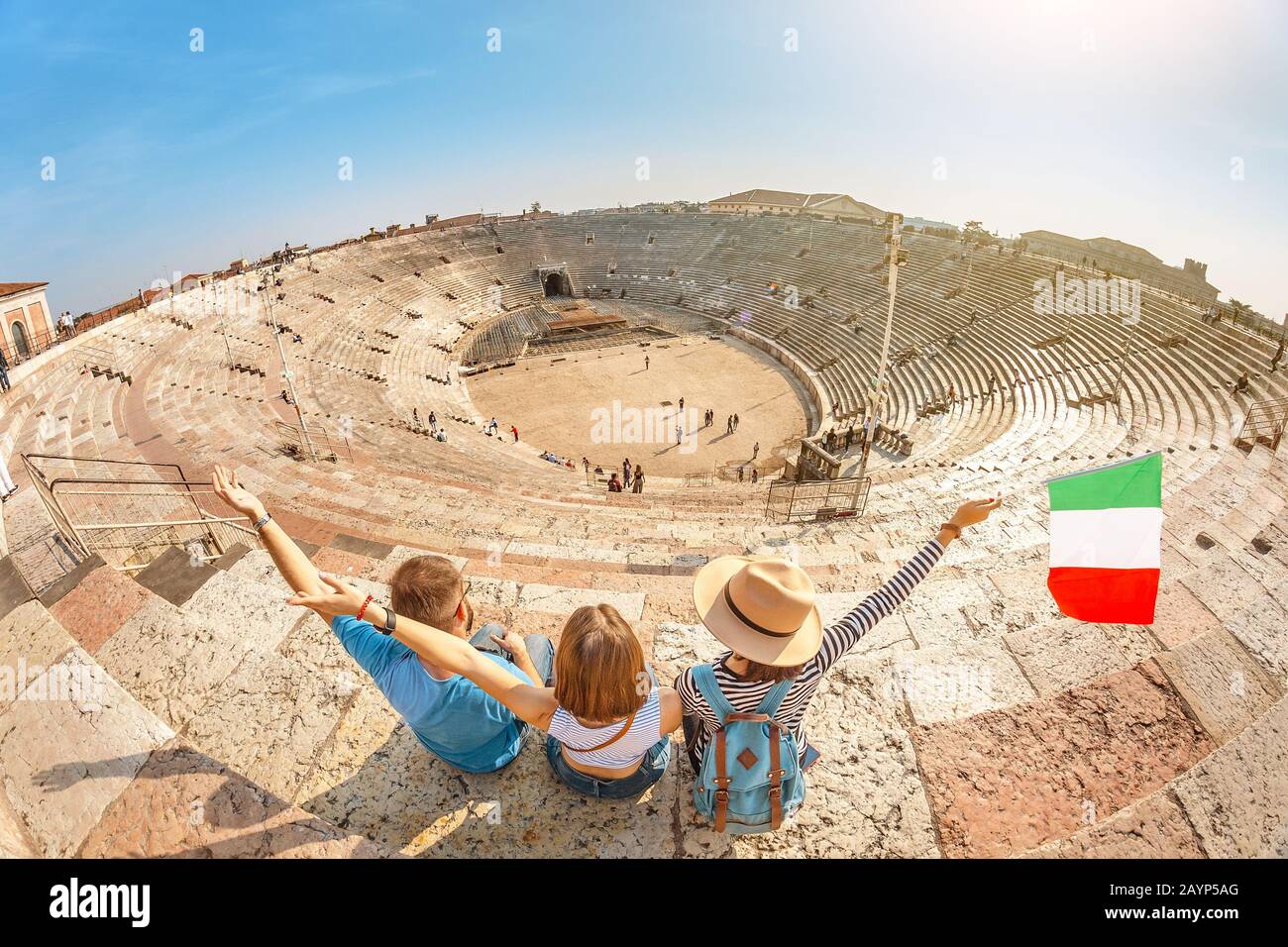 Group of Happy friends tourists with italian flag admiring view of the ...