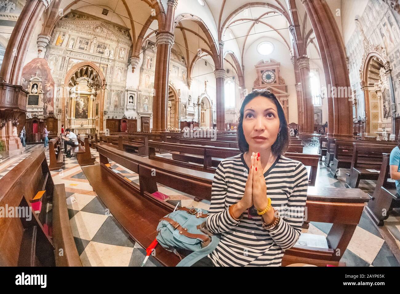Asian Woman praying in church Stock Photo - Alamy