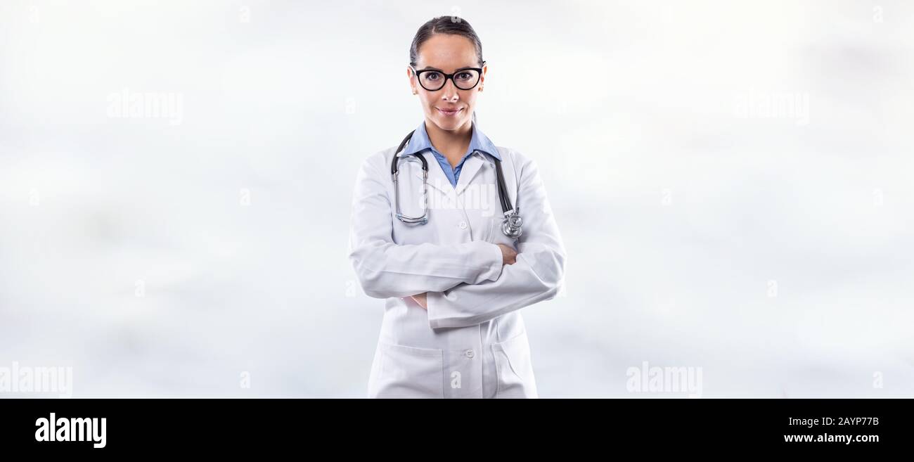Female doctor standing in front of a blurred panoramic background Stock ...