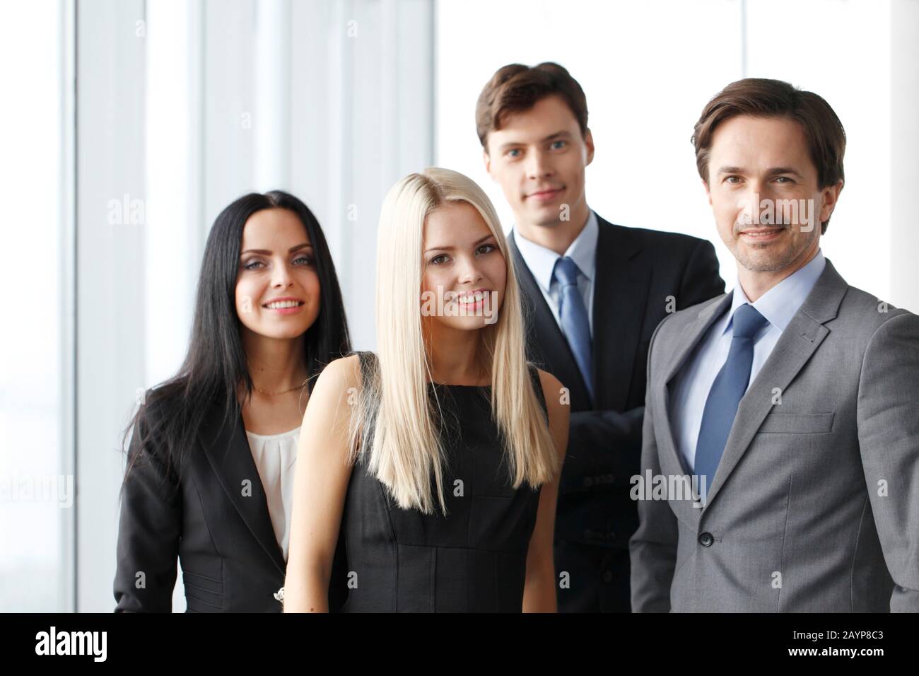 Team corporate employees standing hi-res stock photography and images ...