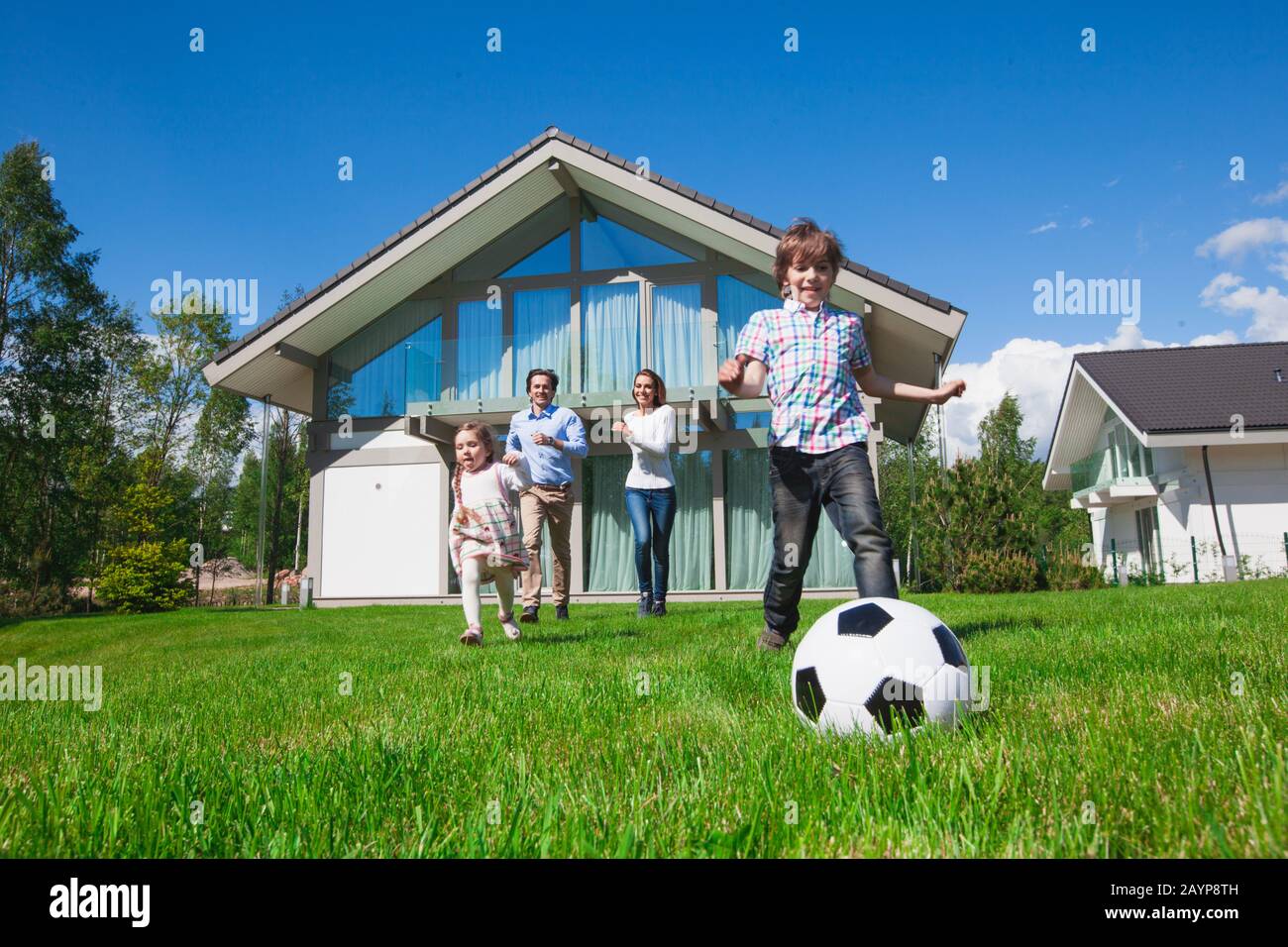 Father kids playing football together hi-res stock photography and ...