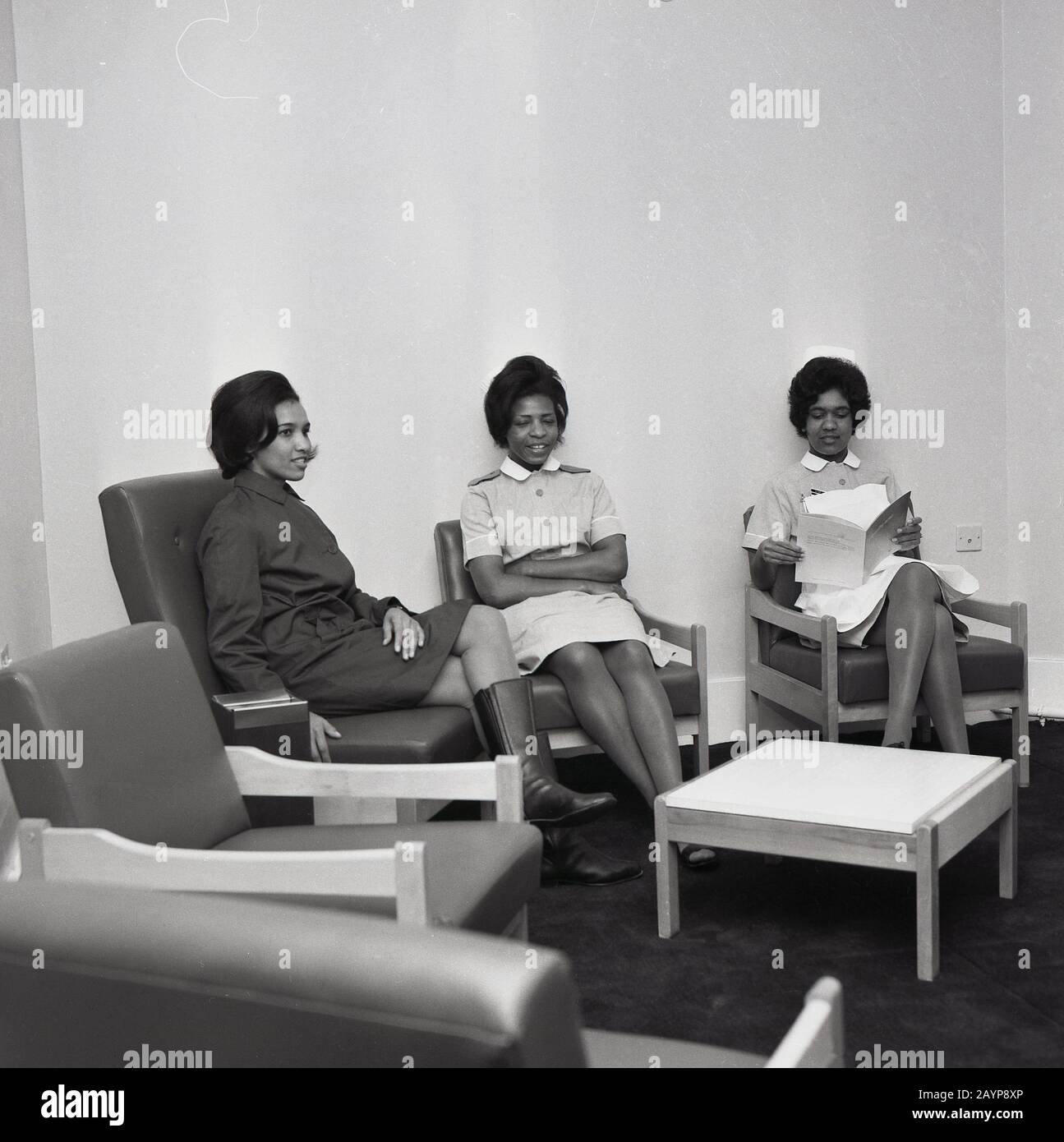 1960s, historical, three female nurses in their common room, sitting on ...