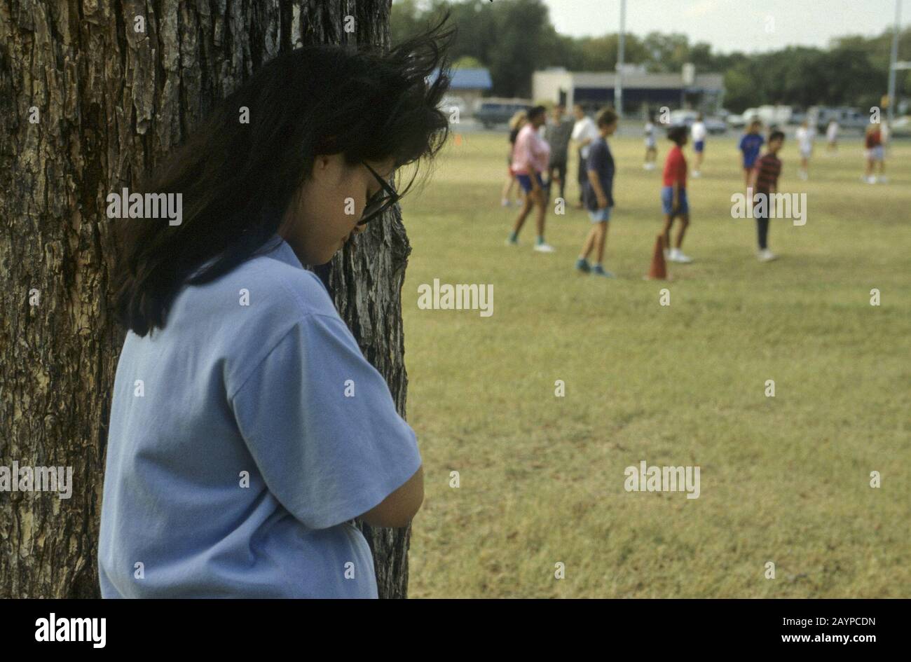 Junior high school girl left out of game due to injury. ©Bob Daemmrich ...