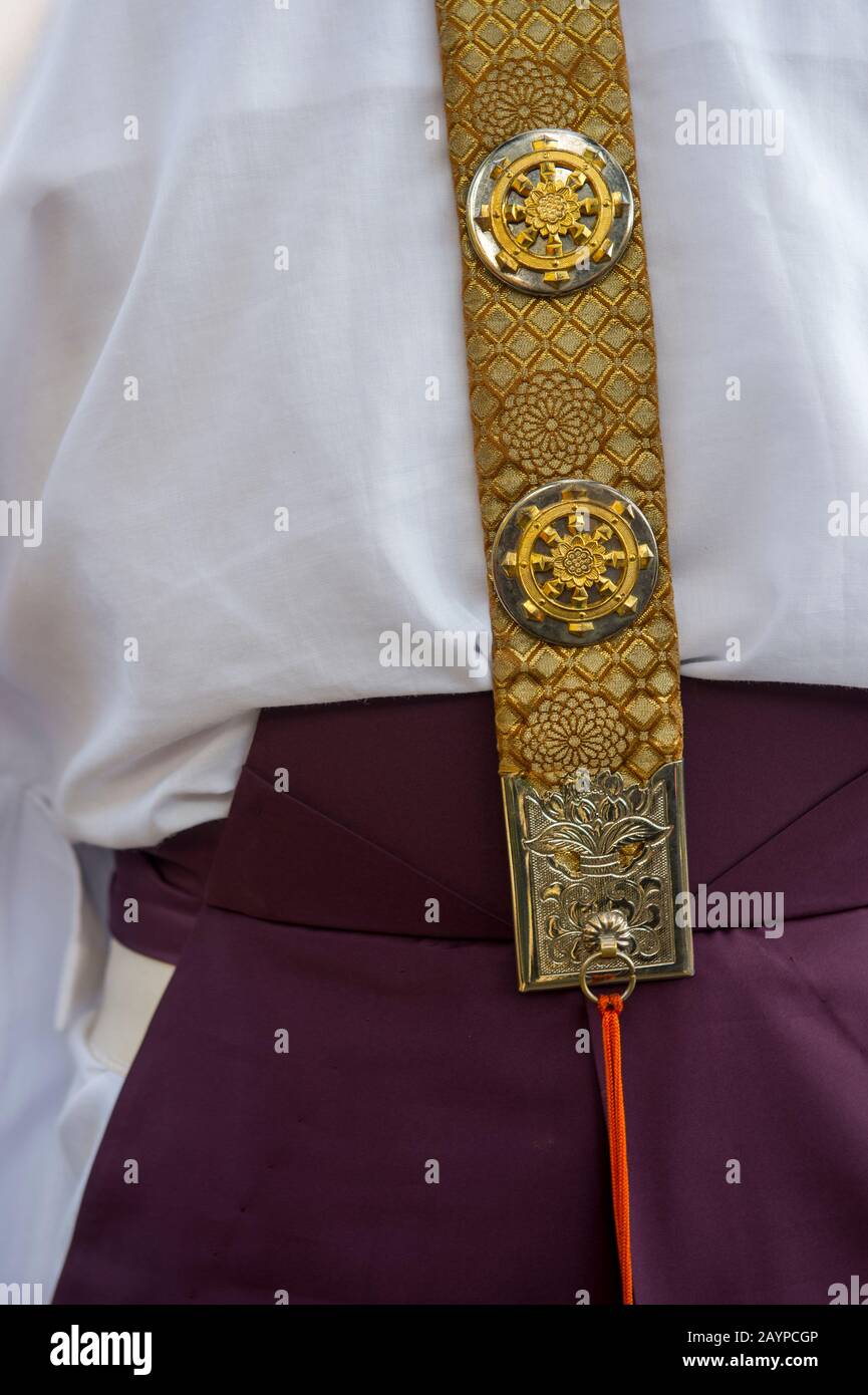 Detail of the traditional clothing of a monk in the garden of the ...