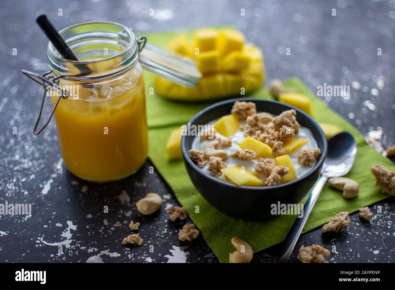 delicious muesli with fresh mango pieces, cashew nuts and yoghurt with ...