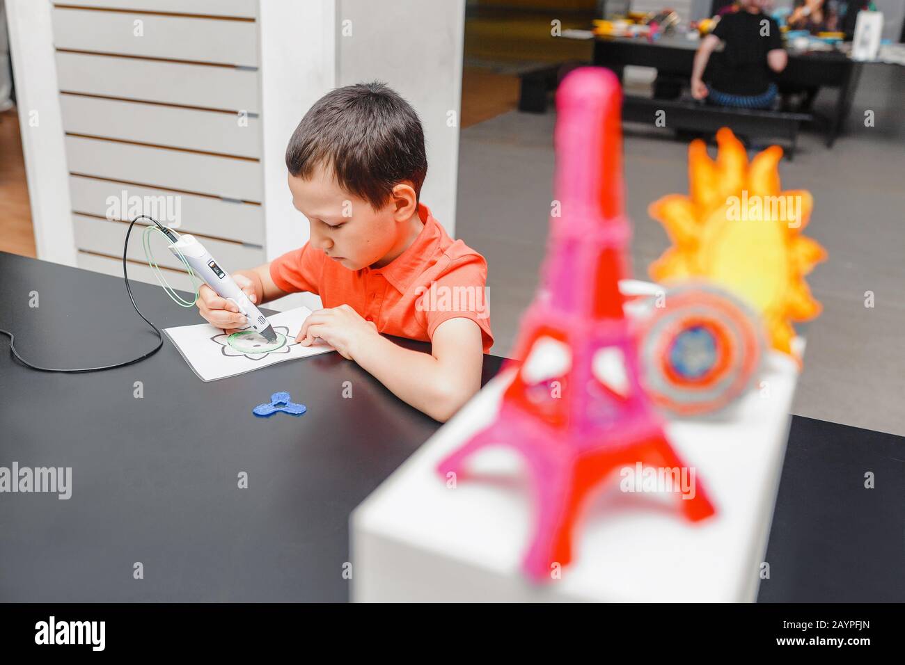 Creative boy with 3d pen learning to draw Stock Photo - Alamy