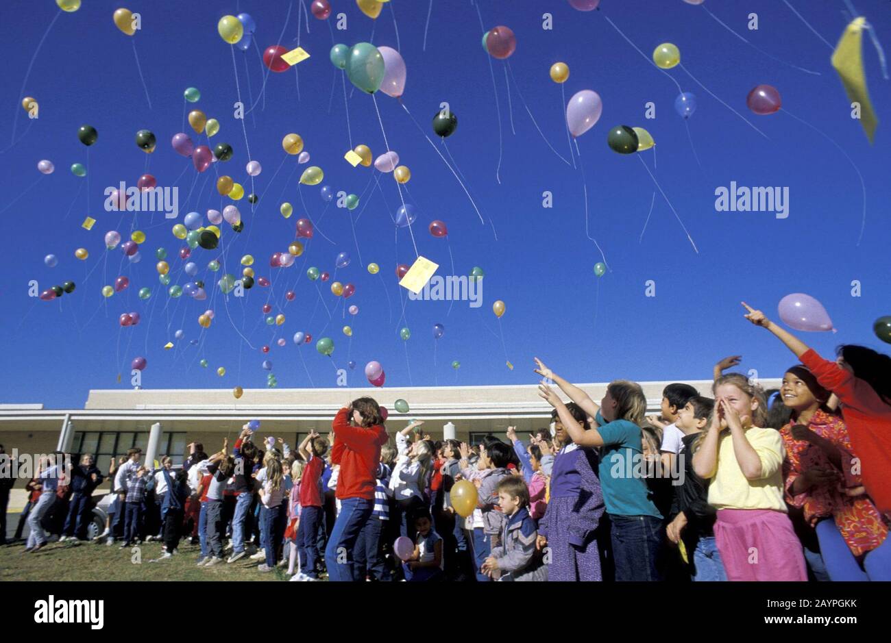 Austin, Texas: Elementary school kids release colorful balloons into ...