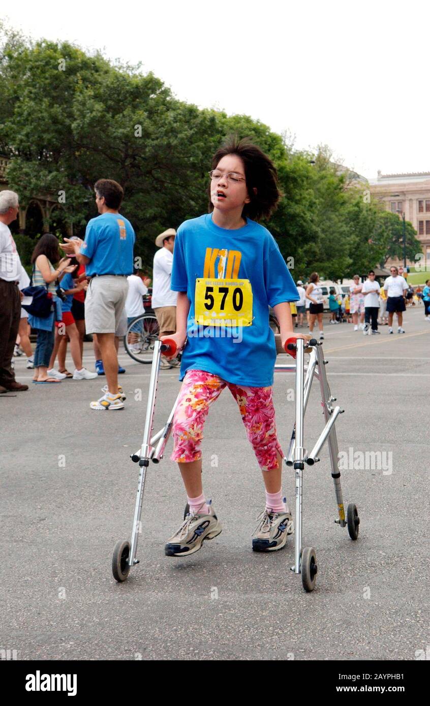 Child using walker disability hi-res stock photography and images - Alamy