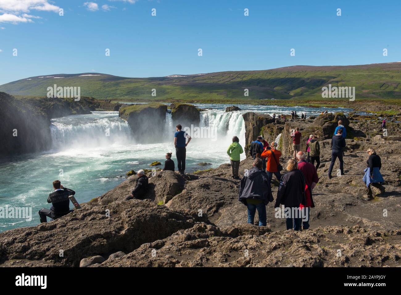 People at the the Godafoss waterfall (Skjalfandafljot River) in ...