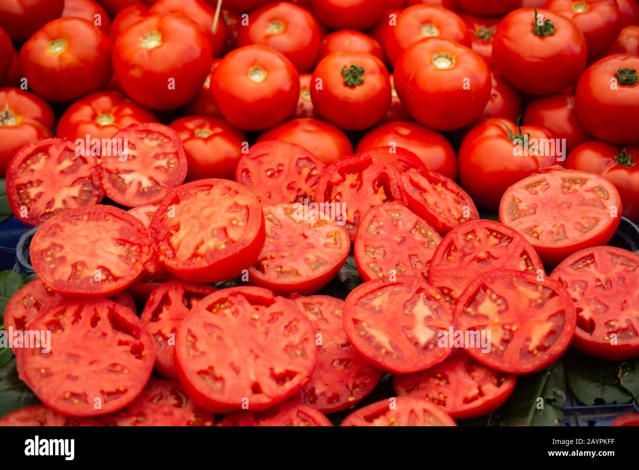 Fresh cut tomato at grocery store for food backgrounds concept Stock ...