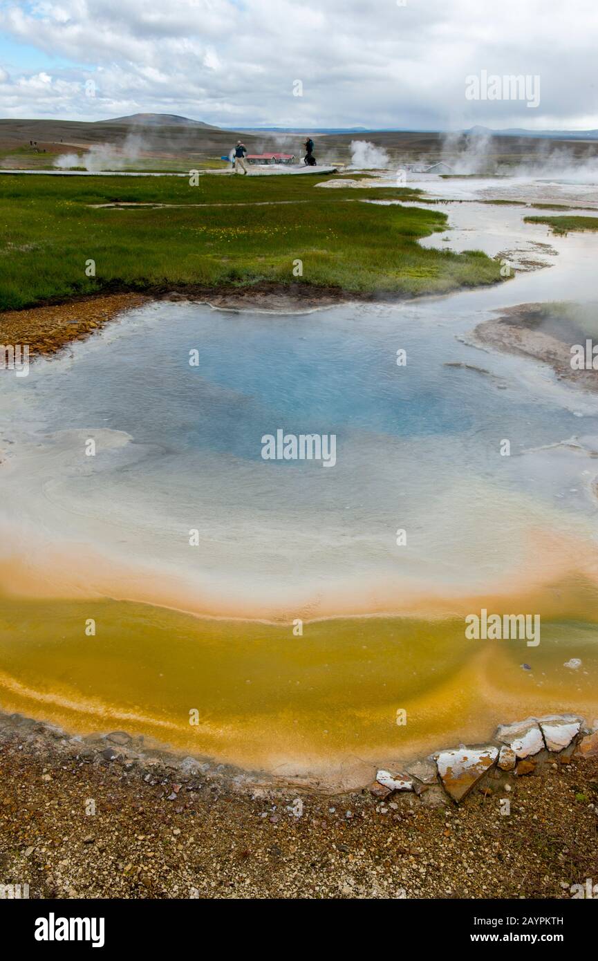 Colorful algae and mineral deposits in the hot springs at Hveravellir ...
