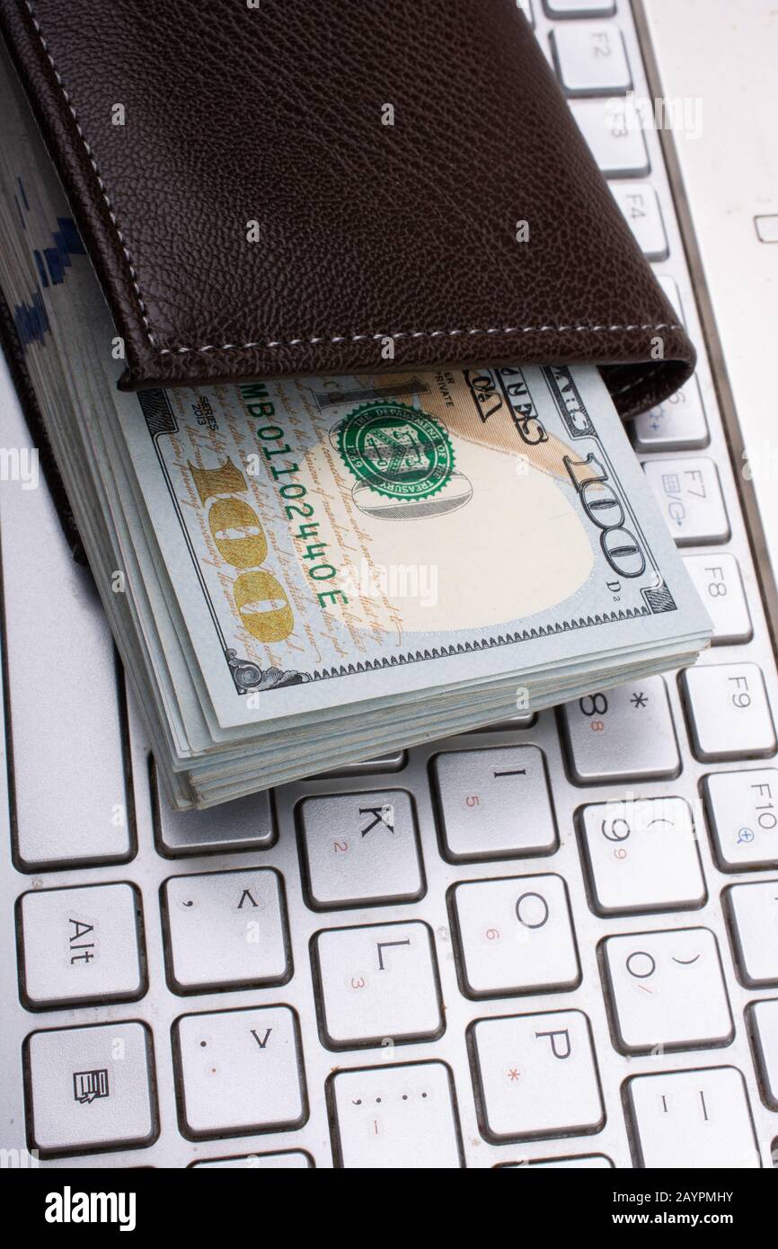 American Dollars Cash Money on computer keyboard Stock Photo - Alamy