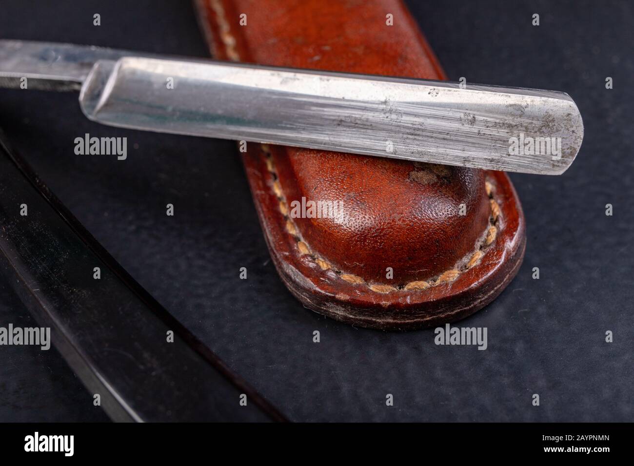 Old sharp razor on a dark table. Hairdresser accessories for shaving ...