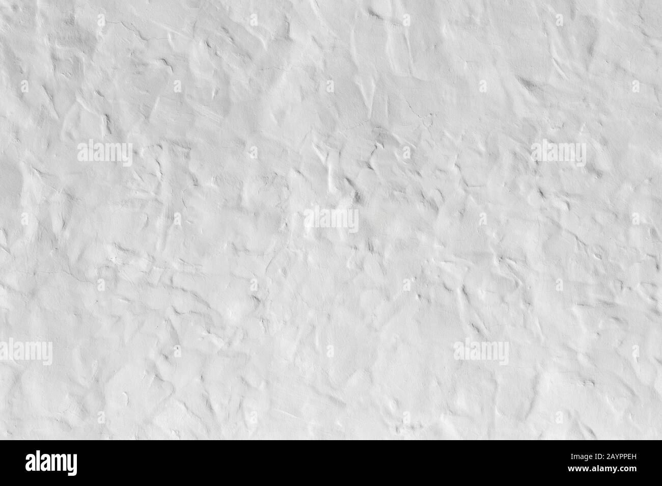 Close up on whitewashed rough wall surface. Uneven roughcast texture ...
