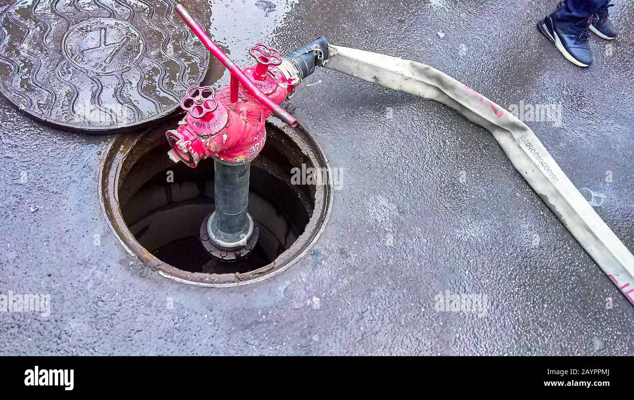 typical Russian red fire hydrant underground Stock Photo - Alamy