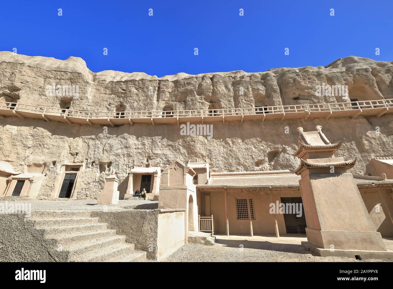 Yulin caves facade-plank path along the cliff. Guazhou county-Gansu ...