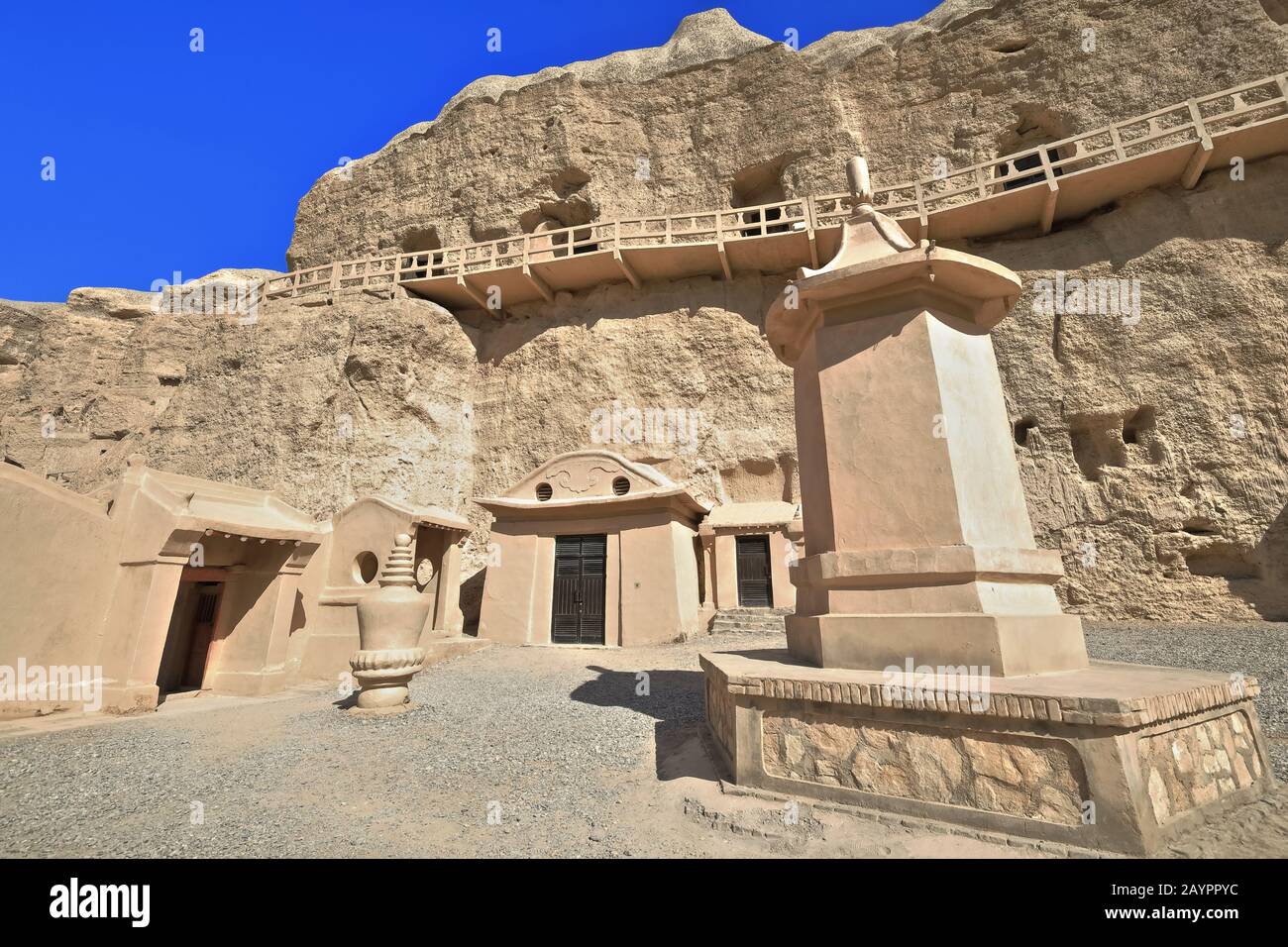 Yulin caves facade-plank path along the cliff. Guazhou county-Gansu ...