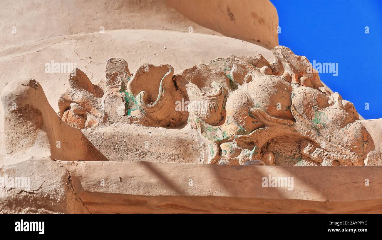 Relief carving-modern clay stupa-foot of Yulin caves. Guazhou county ...