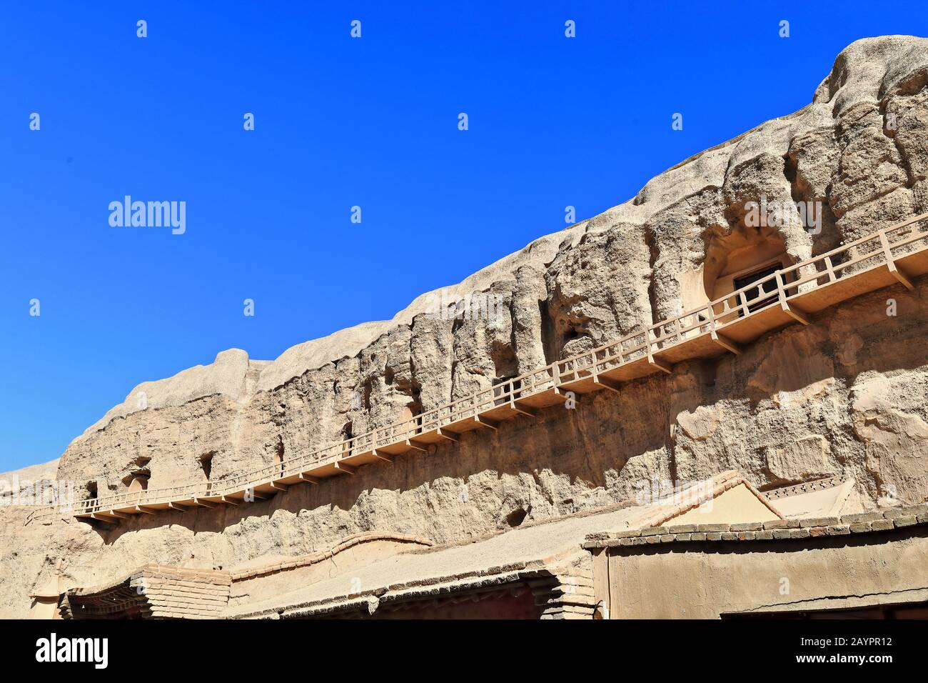 Yulin caves facade-plank path along the cliff. Guazhou county-Gansu ...
