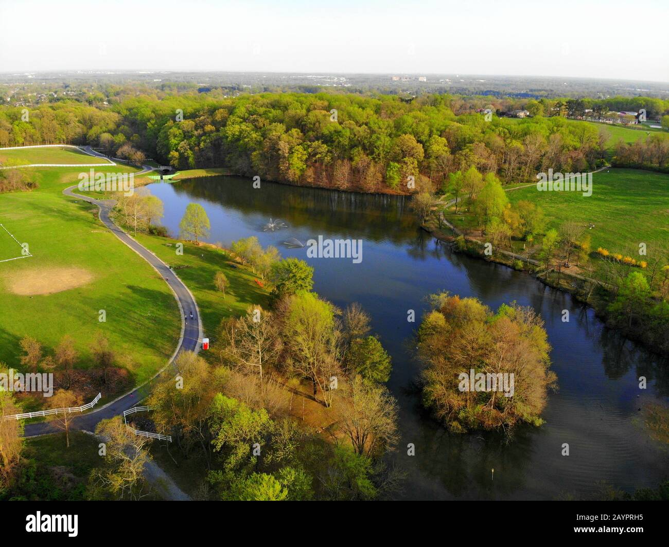The aerial view of the trees and the pond near Carousel Park, Pike ...