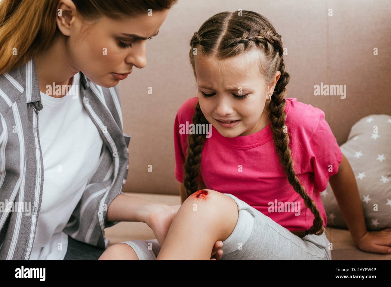 Kid crying mother leg hi-res stock photography and images - Alamy