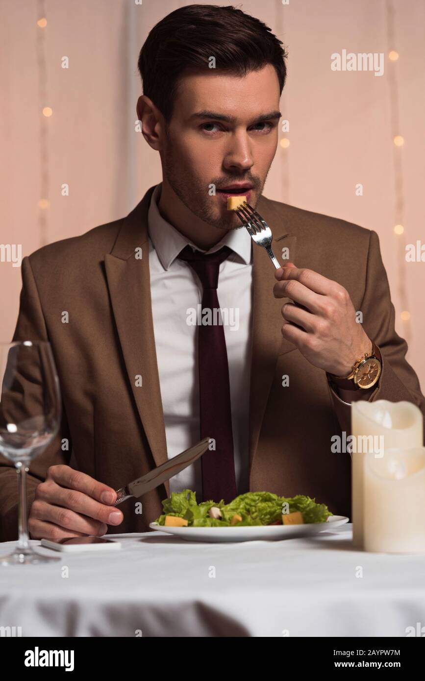 Man eating dinner suit hi-res stock photography and images - Alamy
