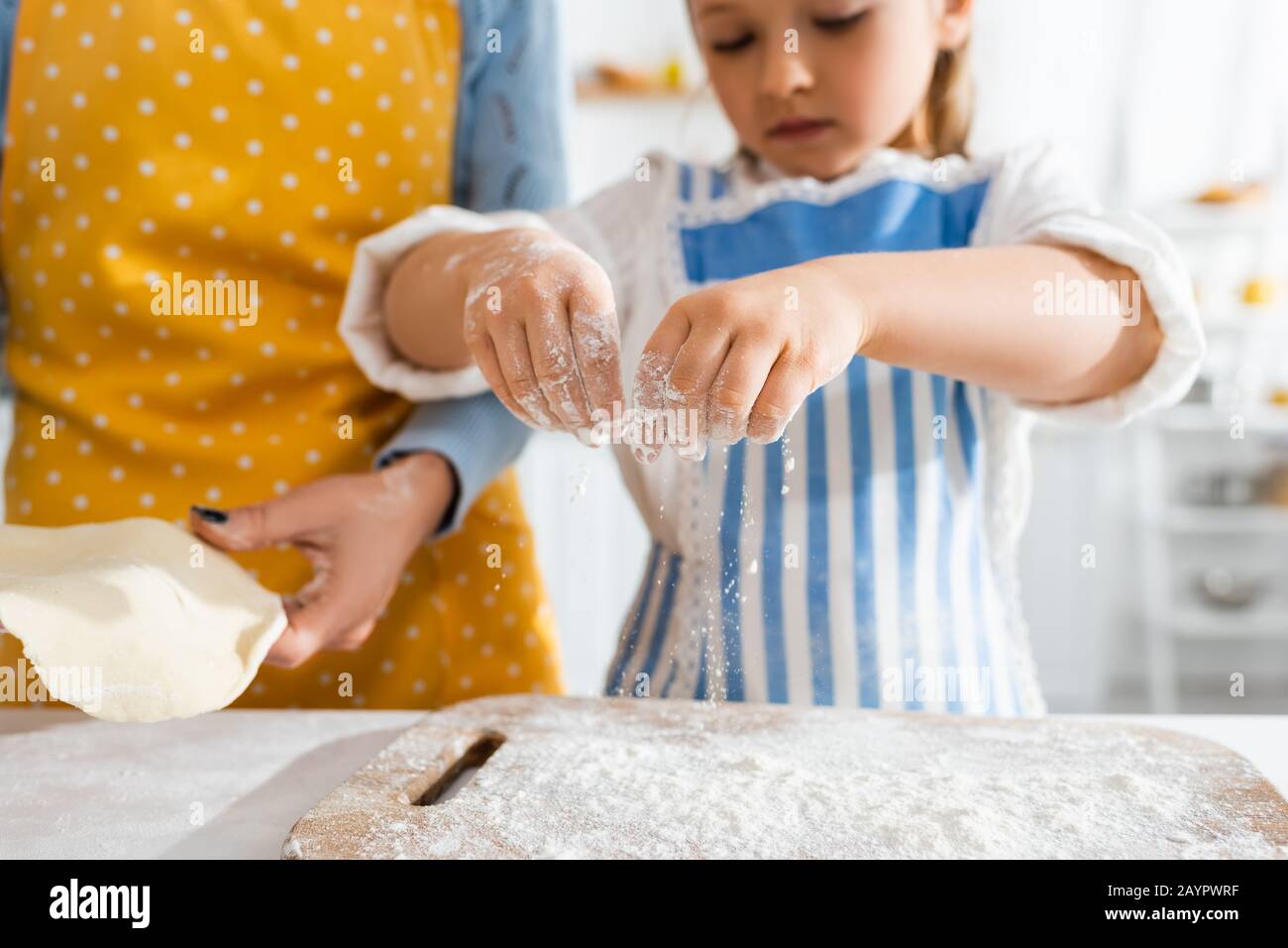 Mom daughter sifting flour dough hi-res stock photography and images ...
