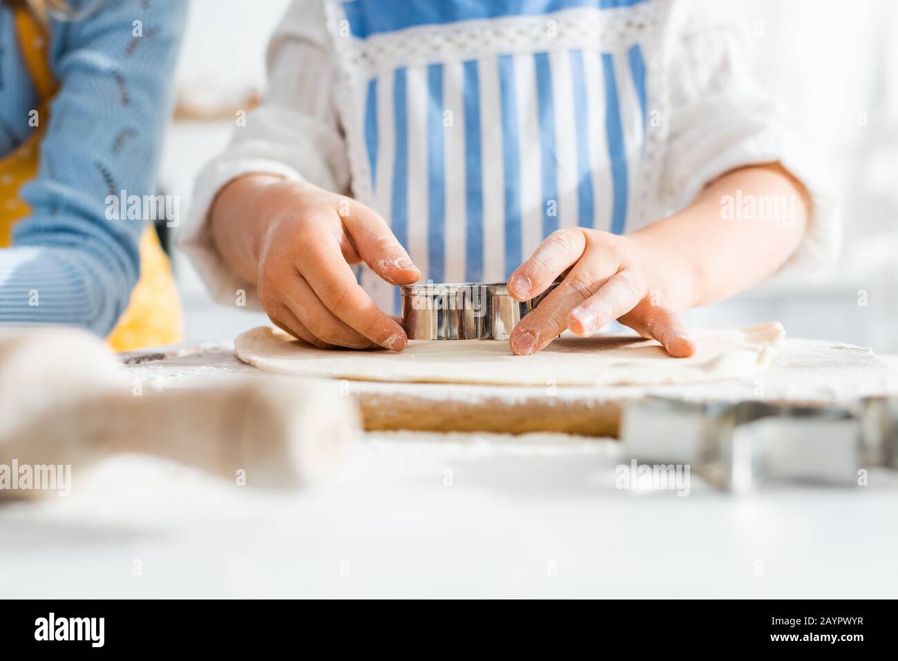 selective focus of kid using dough mold on dough in kitchen Stock Photo ...