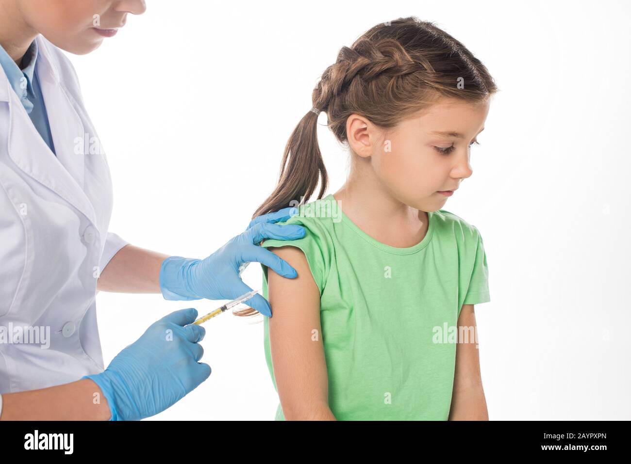 Pediatrician doing injection with vaccine to kid isolated on white ...