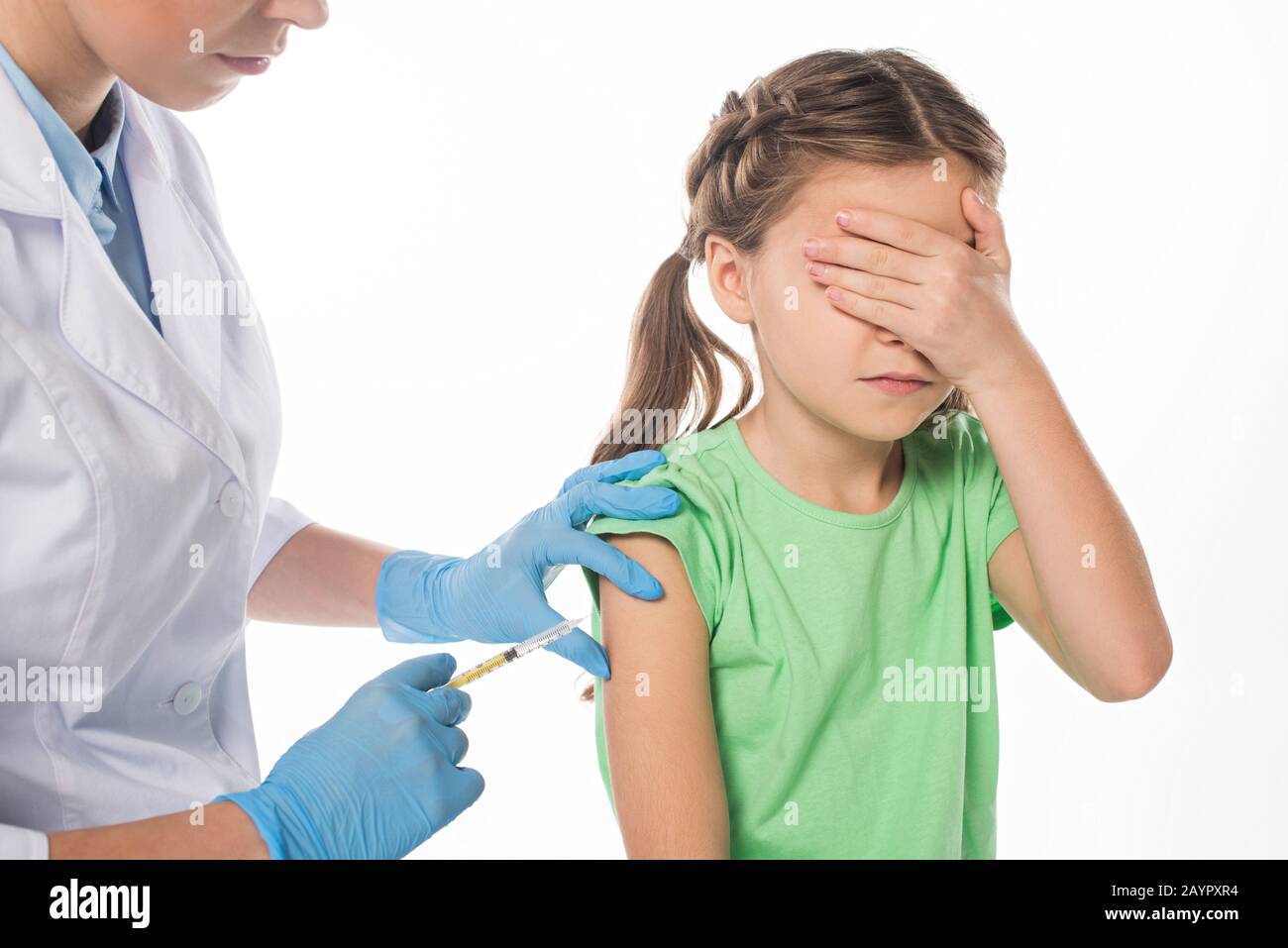 Pediatrician doing injection with vaccine to scared child isolated on ...