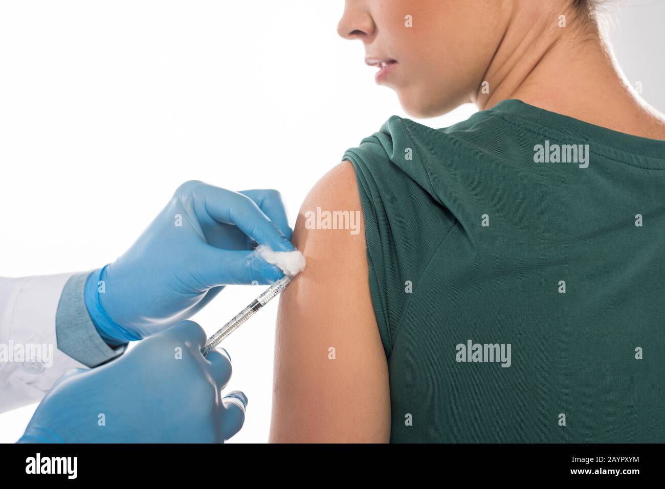 Cropped view of doctor with cotton wool and syringe doing vaccine ...