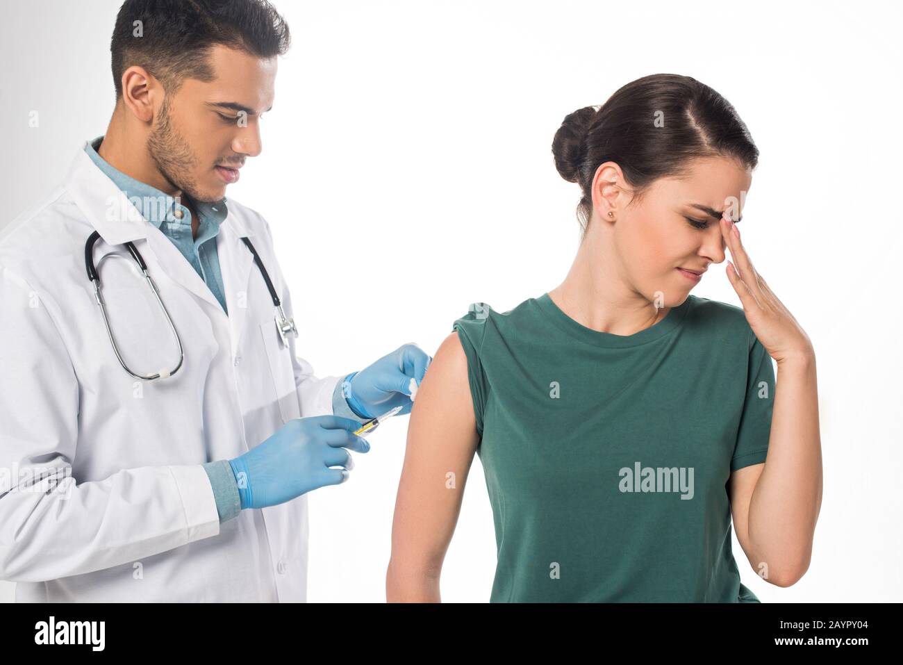 Doctor doing vaccine injection to scared patient isolated on white ...