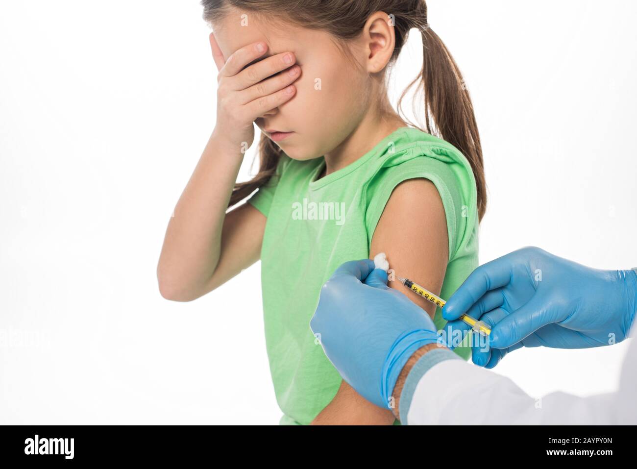 Side view of pediatrician doing vaccine injection to scared child ...