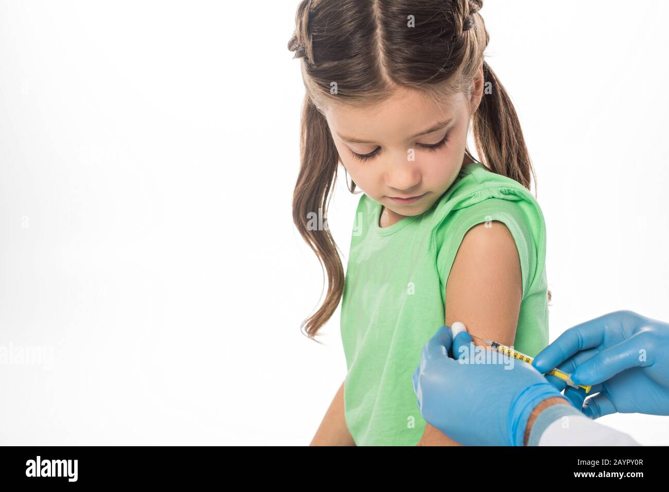 Side view of kid looking at pediatrician doing vaccine injection ...
