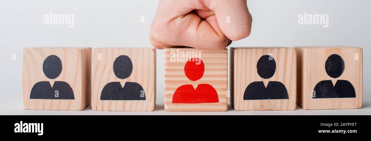 panoramic shot of man with clenched fist near wooden cubes isolated on ...