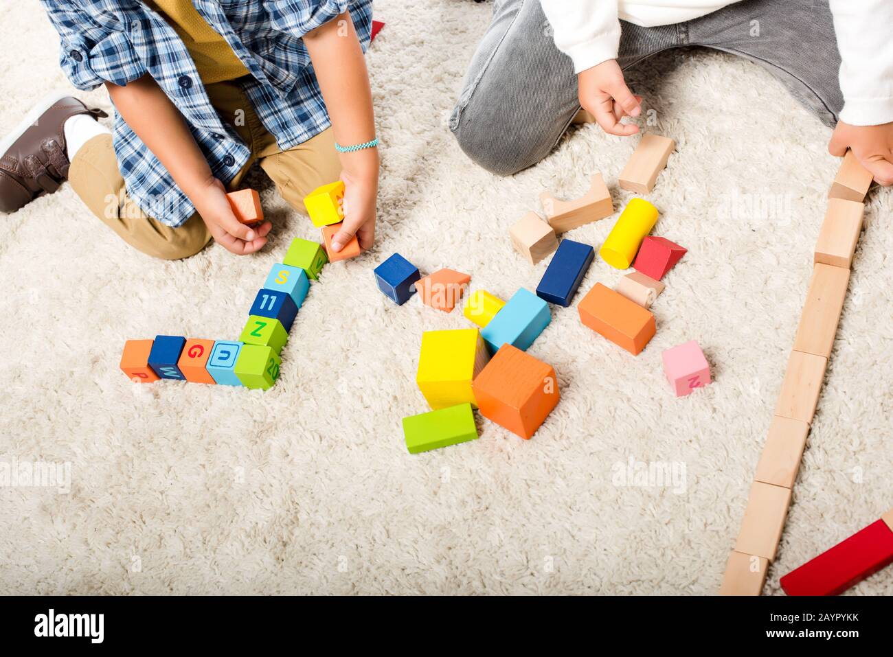 Adorable kids playing together blocks hi-res stock photography and ...
