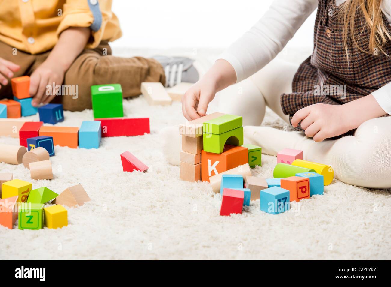 Adorable kids playing together blocks hi-res stock photography and ...