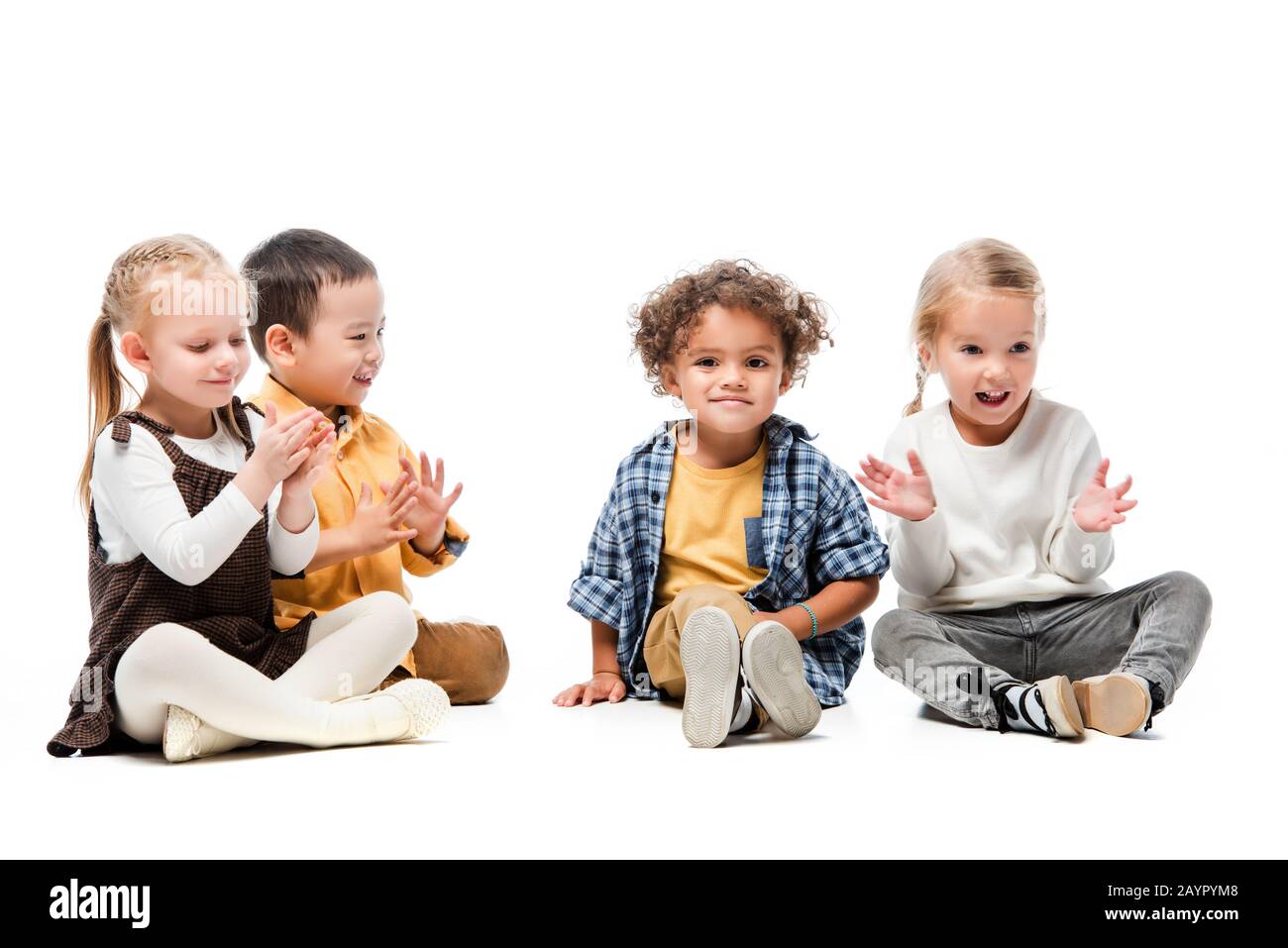 happy adorable multicultural kids playing on white Stock Photo - Alamy